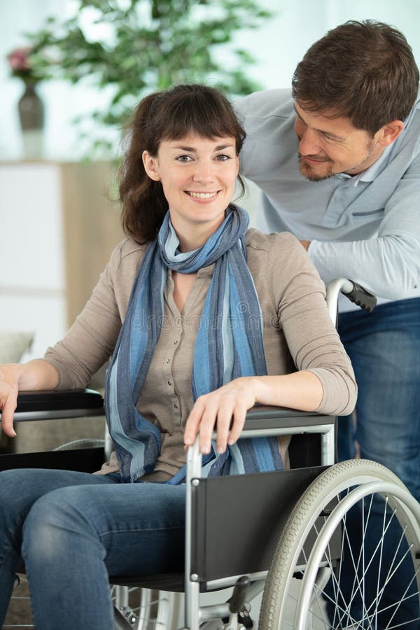 Man Pushing Woman in Wheelchair Stock Image - Image of push, beautiful ...