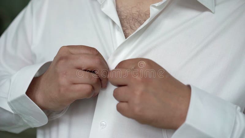 Man put on shirt stock footage. Video of fashion, button - 150865326