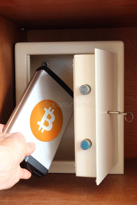 Man Puts External Hard Drive with Bitcoin in Safe Stock Image - Image ...