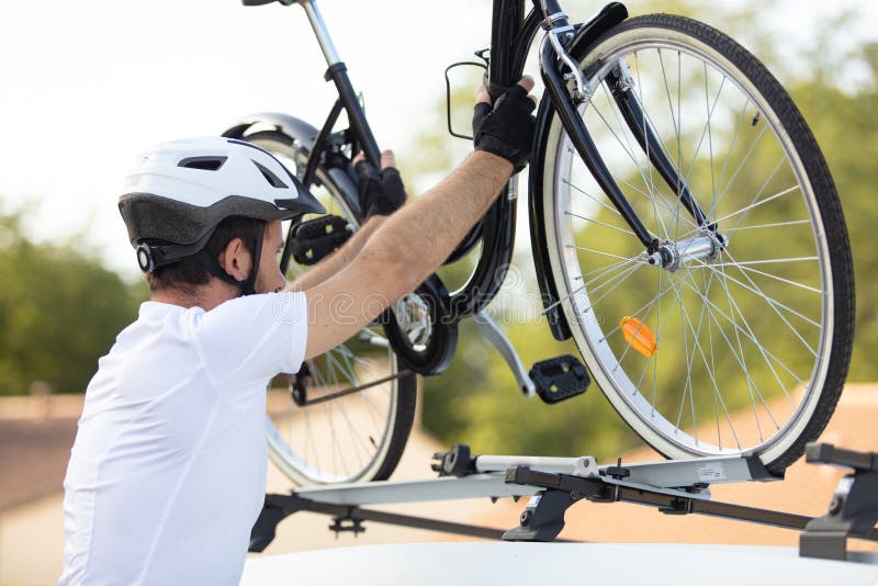 Man Puts Fixed Bicycle on Car Roof Stock Image - Image of modern ...