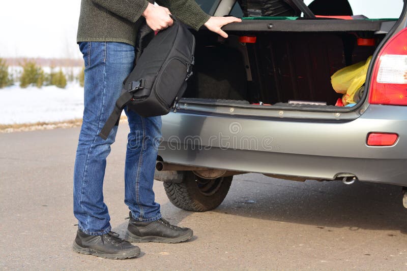 The Man Puts His Backpack in the Car Stock Photo - Image of start ...