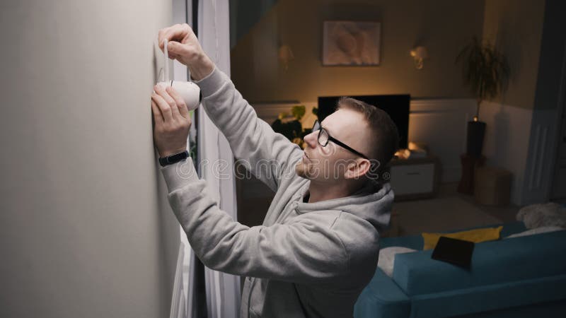 Man Puts Security Camera on Wall Mount Stock Image - Image of device ...