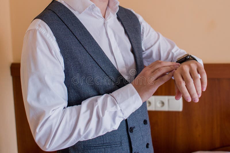 Man Puts a Watch on His Hand Stock Image - Image of person, late: 184571997