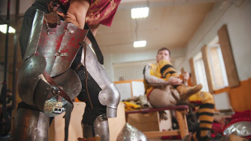 A Man Putting on an Armour for the Knights Battle Training Stock ...
