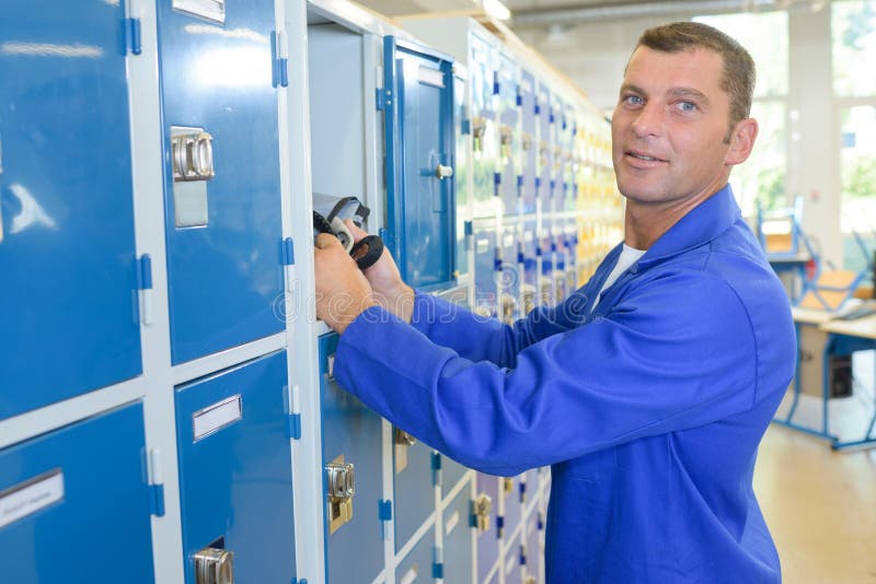 Man Putting Belongings in Locker Stock Image - Image of lock, portrait ...