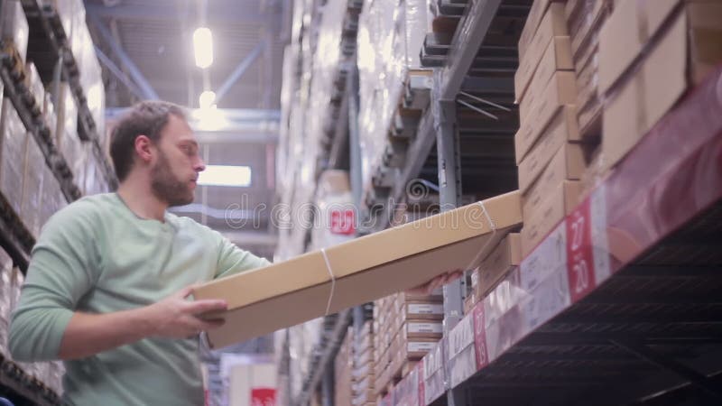 Man is Putting Boxes in Trunk of His Car and Closes it after Shopping ...