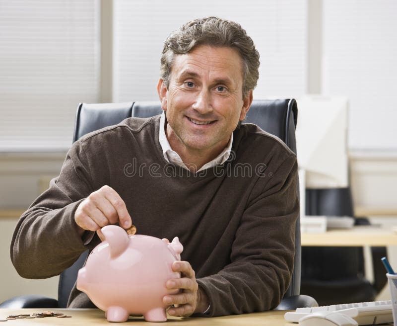 Man Putting Coin in Bank stock photo. Image of fifties - 10011552