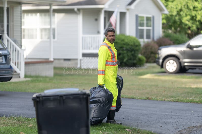 Man Putting Garbage Bag in a Trash Bin. Environmental Protection ...