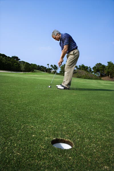 Man Putting at Golf Course. Stock Image - Image of play, game: 2038323