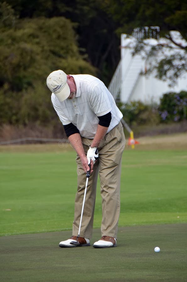 Man putting on golf greens editorial image. Image of ball - 36806015