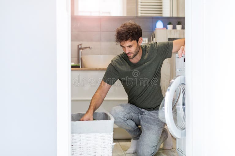 Man Loading Washing Machine Stock Image - Image of house, putting ...
