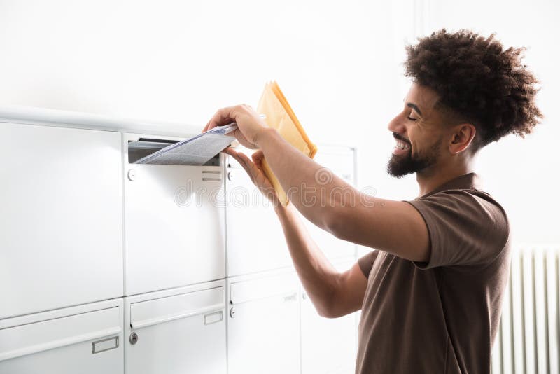 Man Putting Letters in Mailbox Stock Image - Image of message, happy ...
