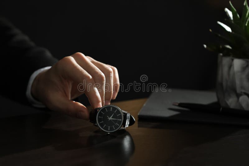 Man Putting Luxury Wrist Watch on Table, Closeup. Space for Text Stock ...