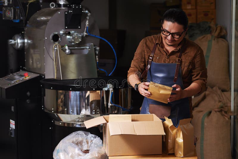 Packing coffee for selling stock photo. Image of shipping - 116067340