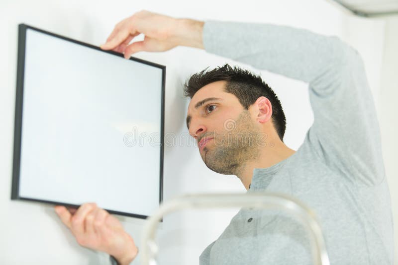 Putting Up Poster Stock Photos - Free & Royalty-Free Stock Photos from ...