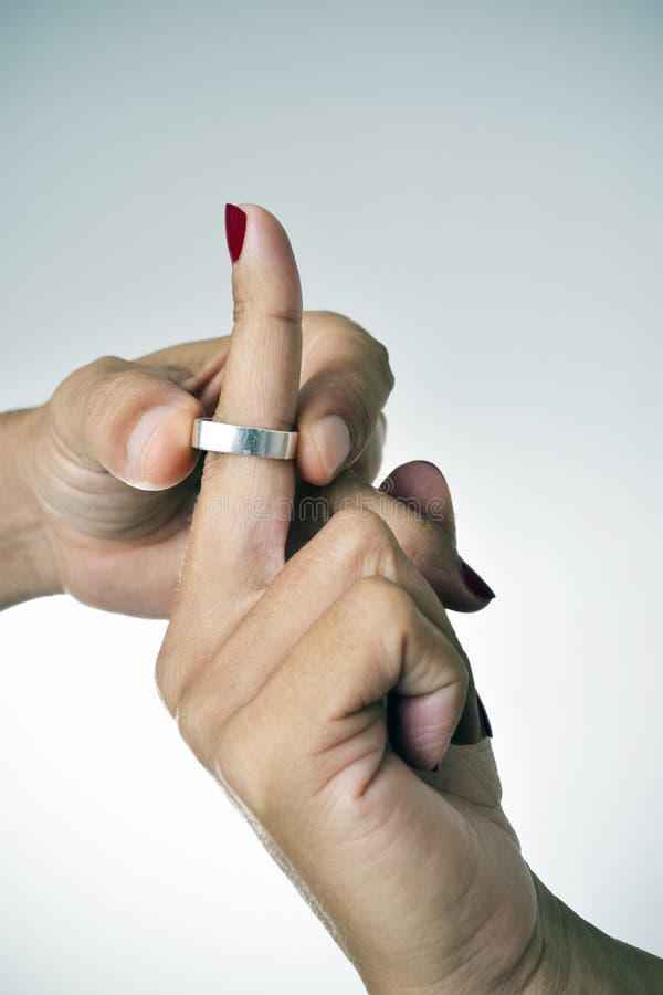 Man Putting on or Putting Off a Ring from the Finger of a Woman Stock ...