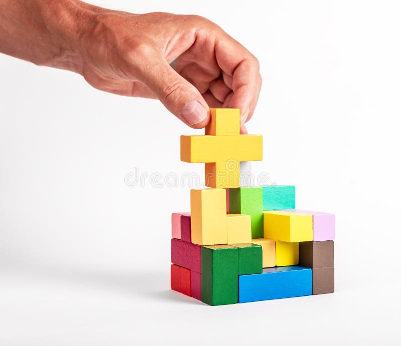 Man Putting Puzzle Elements Together in Construction. Assembly ...