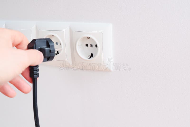 Man Putting on or Removing Electric Plug Cable in Socket, Closeup ...