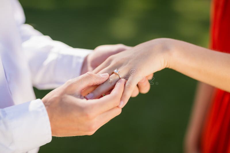Man Putting a Ring on Womans Finger in the Restaurant Stock Image ...
