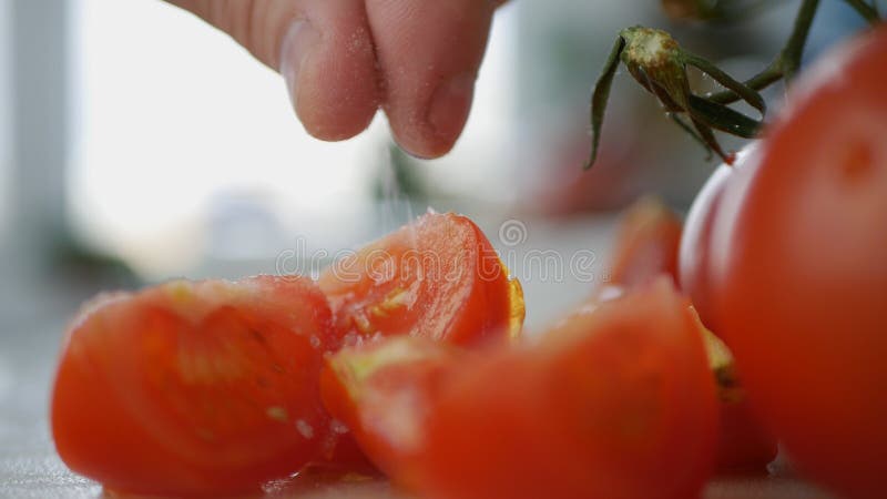 Man Putting Salt on Slices of Red Tomatoes Stock Image - Image of ...