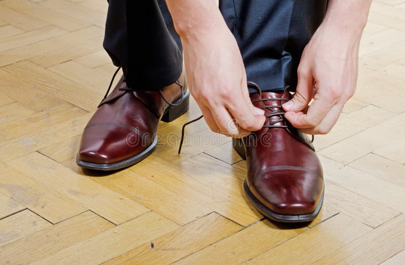 Man putting on shoes stock photo. Image of wooden, groom - 67935744