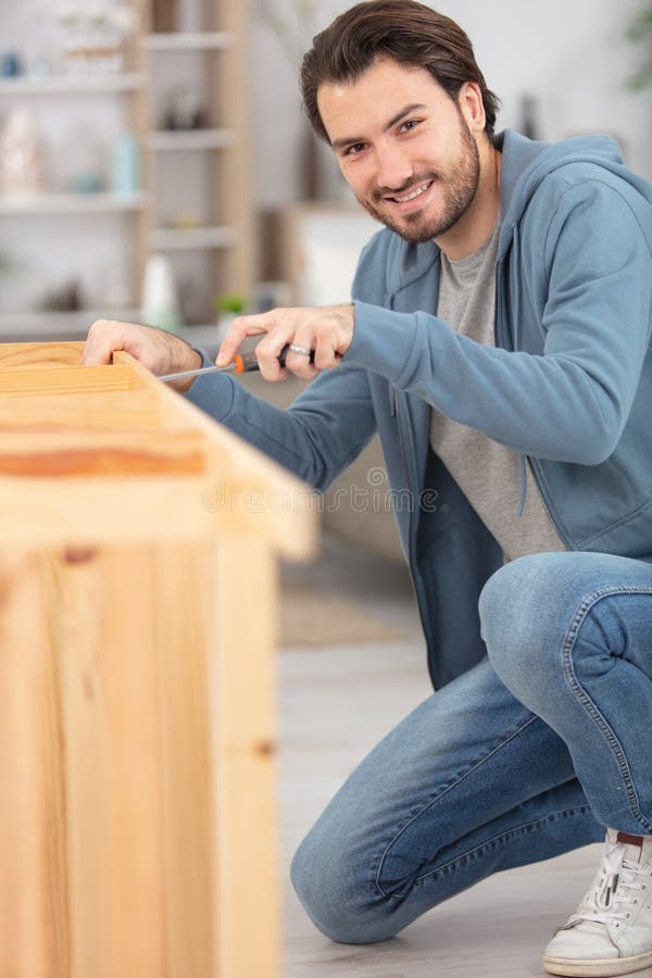 Man Putting Together Self Assembly Furniture Stock Photo - Image of ...