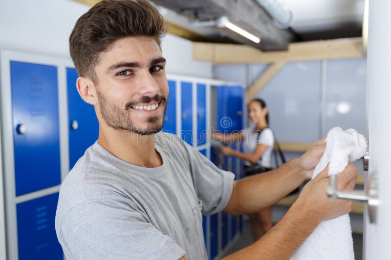Man Putting Towel on Hook in Locker Room Stock Photo - Image of trainer ...