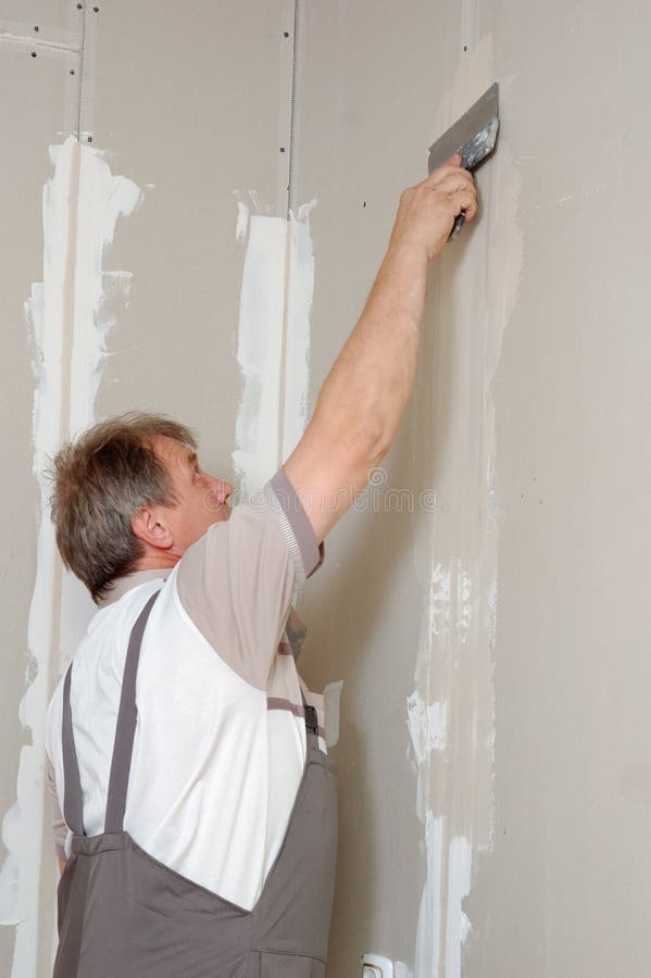 Man putty plasterboard stock photo. Image of caucasian - 15484438