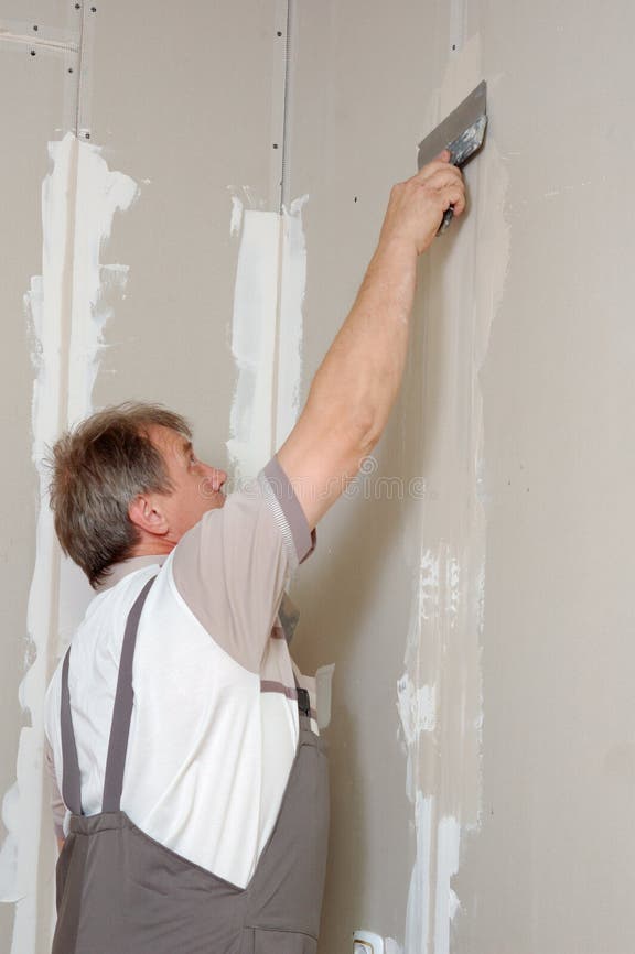 Man putty plasterboard stock photo. Image of caucasian - 15484438