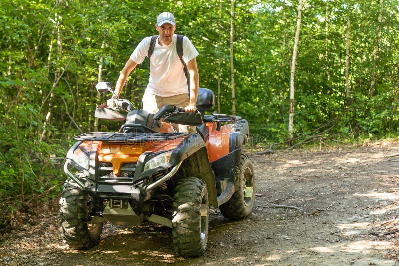 Man Quad Bike in the Forest Stock Image - Image of holiday, extreme ...