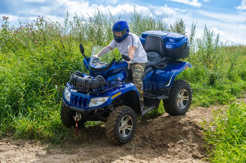 Man on ATV stock image. Image of bike, helmet, wheel - 32891935