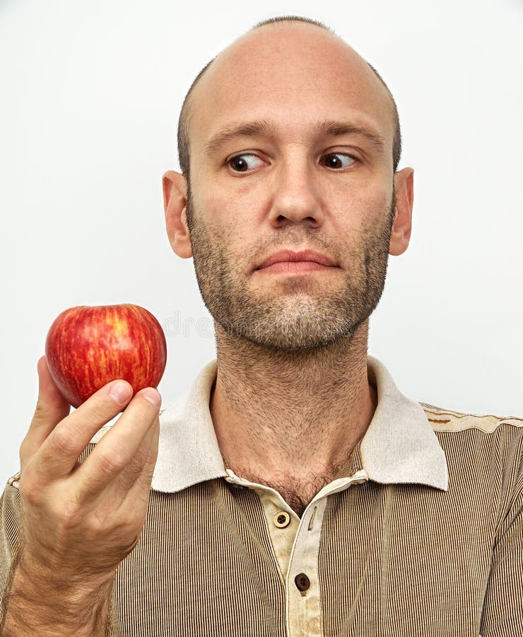 Man Questioningly Looking Red Apple Stock Photos - Free & Royalty-Free ...