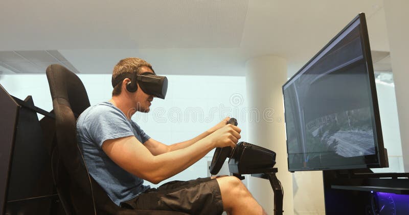 Man racing in VR headset stock image. Image of automobile - 121945647