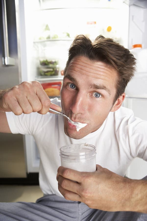 Man Raiding the Fridge at Night Stock Photo - Image of enjoyment ...