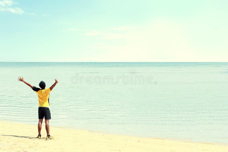 Man Raised Arm on the Beach Stock Image - Image of healthy, action ...