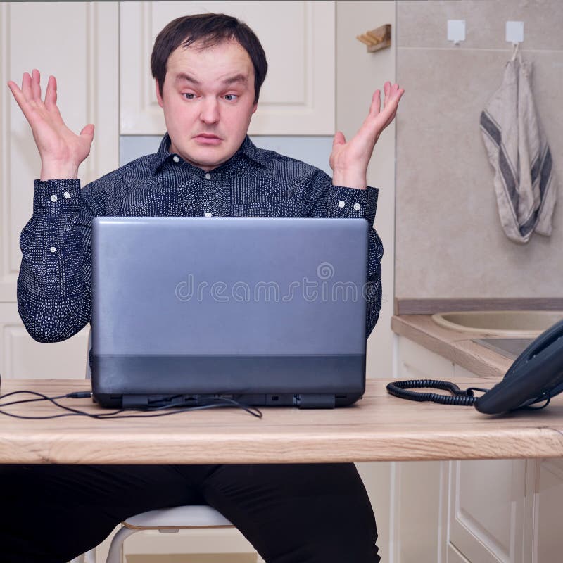 The Man Raised His Hands in Frustration while Working on the Computer ...