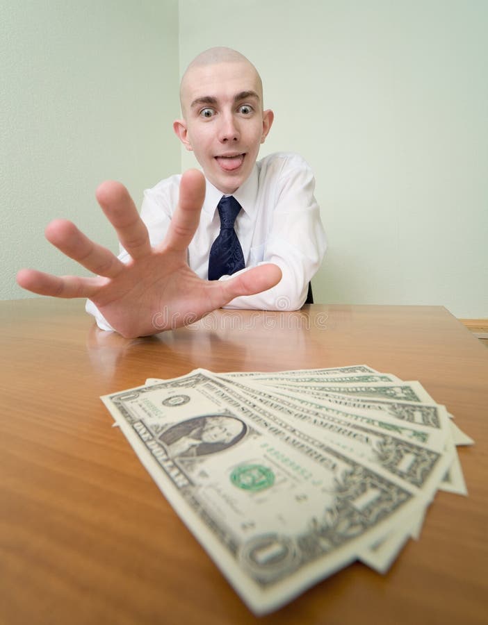 Man Reaches for a Batch of Money Stock Image - Image of person, emotion ...