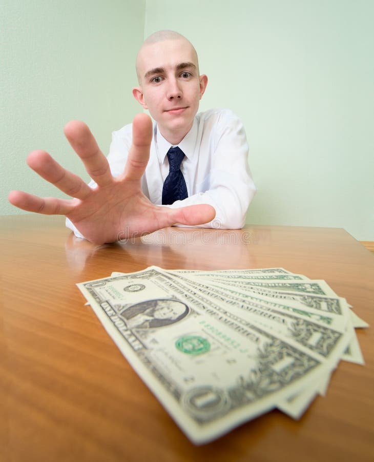 Man Reaches for a Batch of Money Stock Photo - Image of brown ...