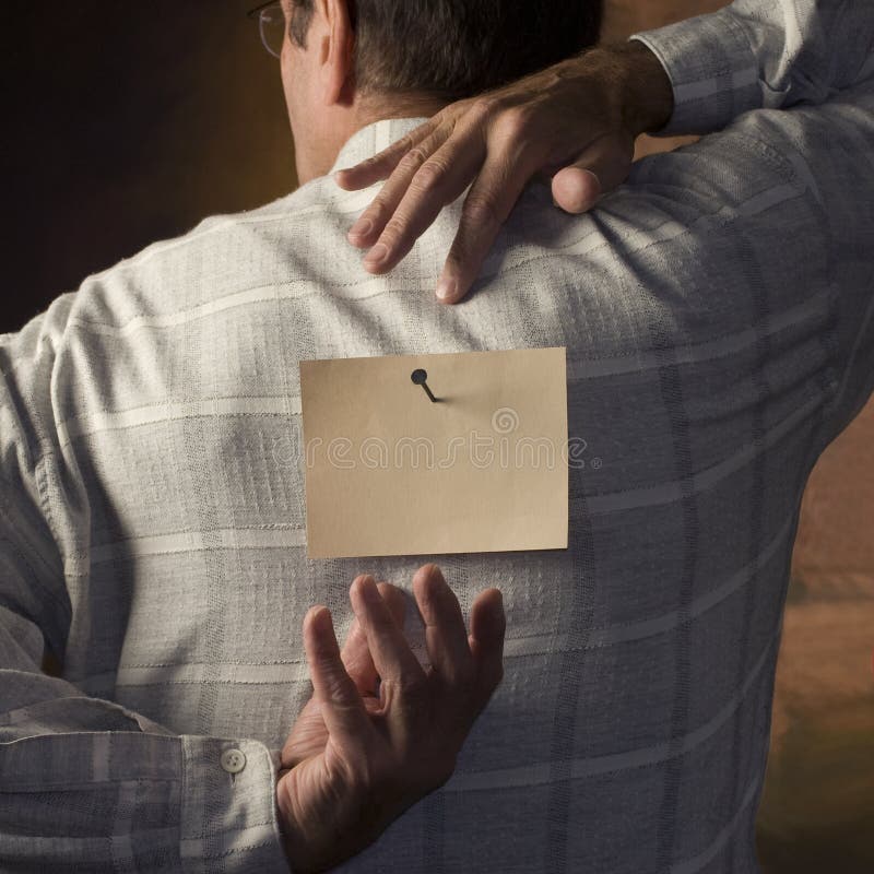 Man Reaching for Communication or Note on Back Stock Photo - Image of ...