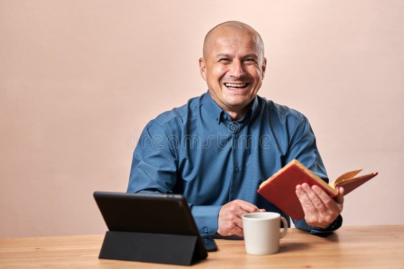 Man Reading an Amusing Book Stock Image - Image of wireless, fawn ...