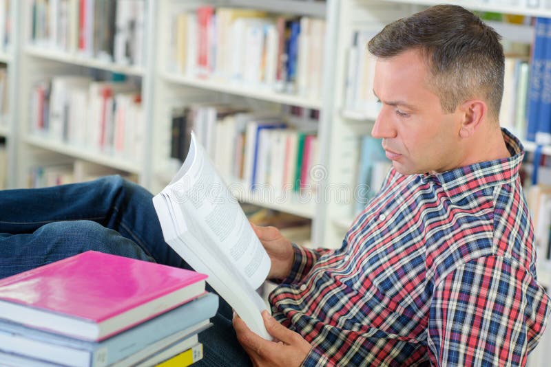 Man reading book stock image. Image of reader, freelance - 259239629