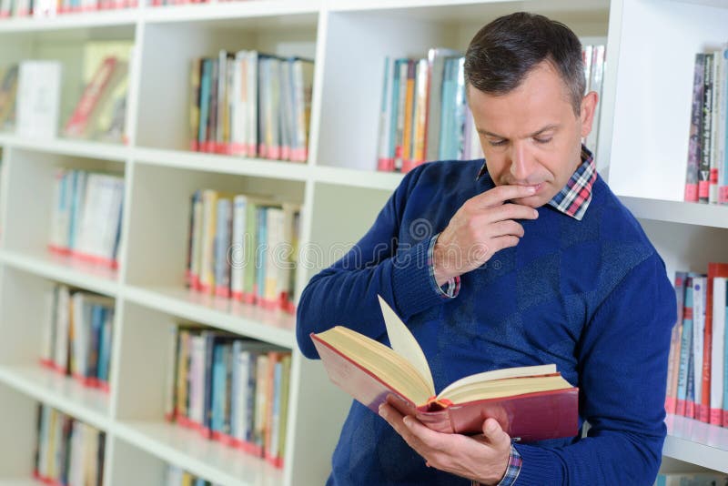 Happy man in library stock image. Image of survey, teller - 262850173