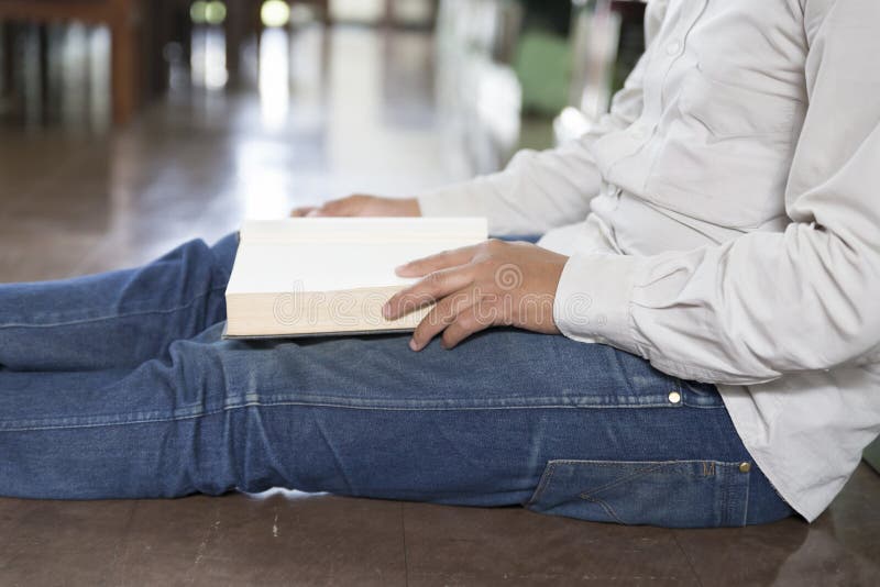 Man Reading Book in Aisle in Library Stock Image - Image of research ...