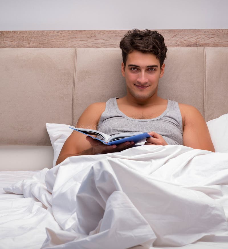 Man Reading Book in the Bed Stock Photo - Image of awake, morning ...