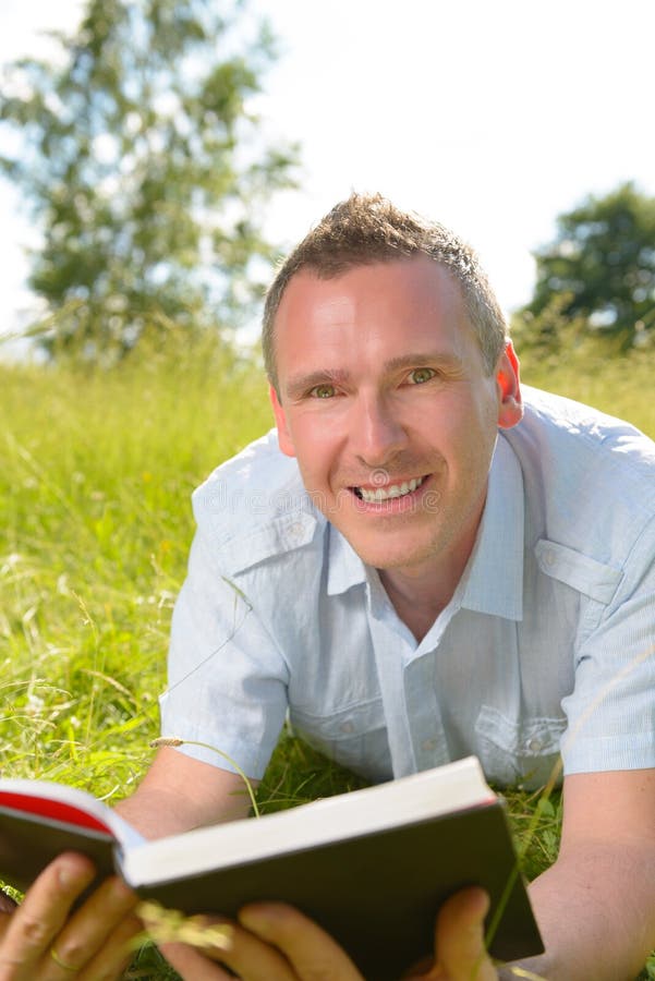 Man reading book stock image. Image of green, casual - 41774255