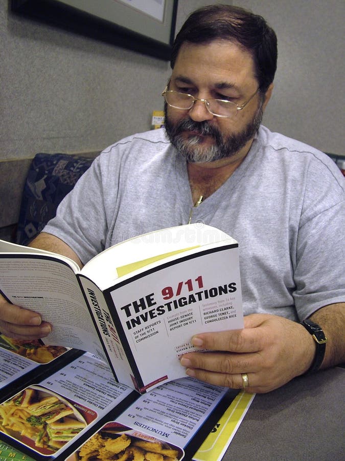 A Man Reading a Book an the 911 Terrorist Attacks on New York and ...