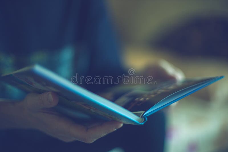 Man is Reading a Book, Male Hands are Holding a Book, Side View Close ...