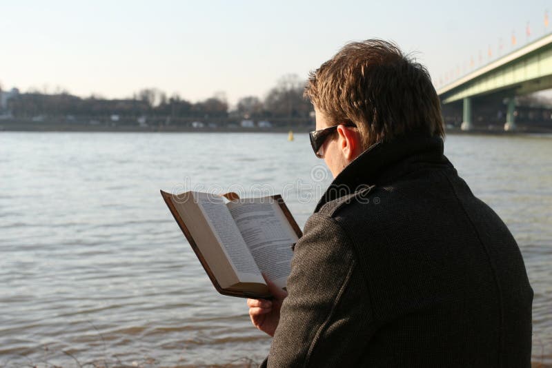 Man reading book outdoor stock photo. Image of reading - 9074784