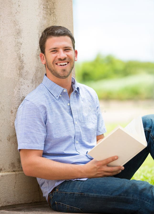 Man reading book outside stock image. Image of green - 42018573