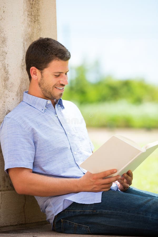 Man reading book outside stock image. Image of park, learning - 42018577